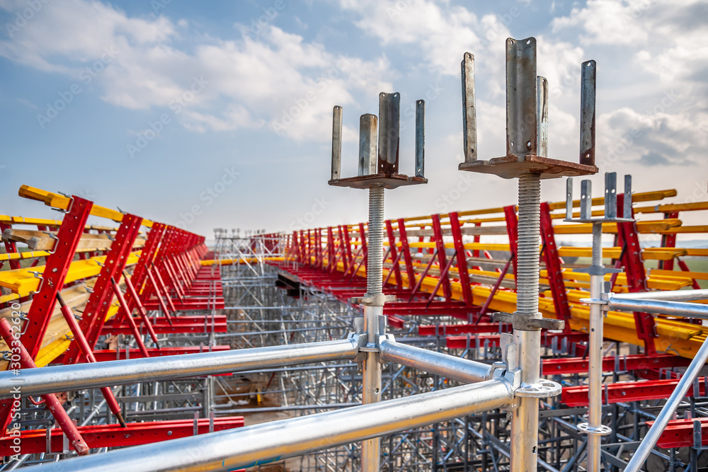 The supporting structure of scaffolding and metal beams on the ...