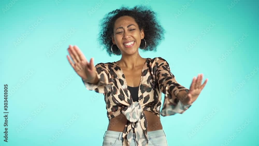Smiling woman raising hands up to say no stop. Sceptical and ...