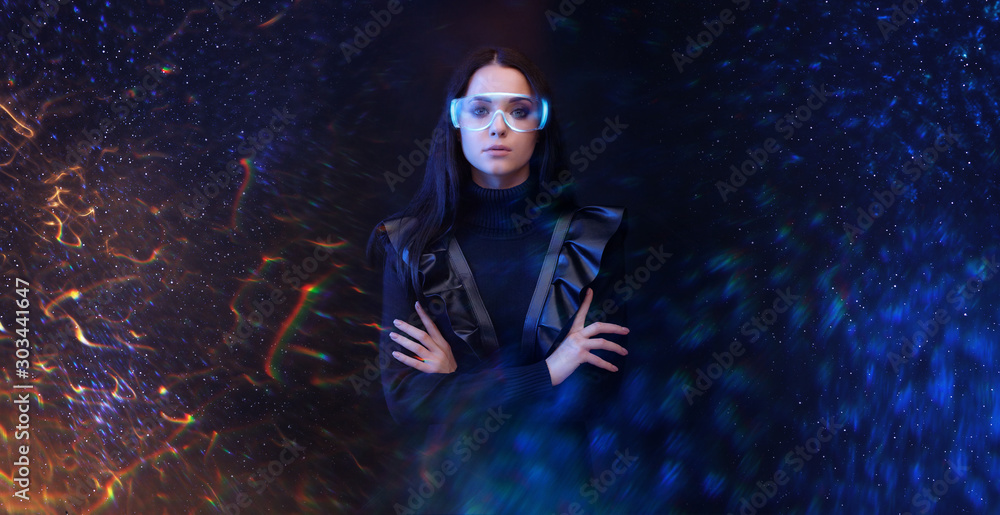 Beautiful young woman having virtual reality experience. Girl using VR ...