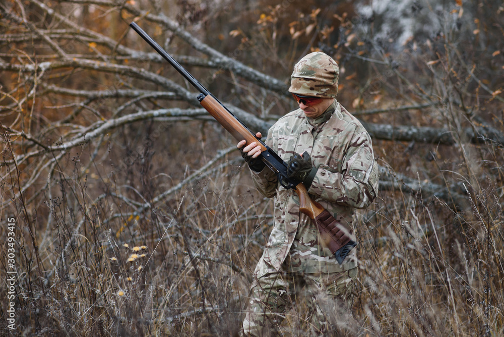 Hunter handsome guy with weapon. Hunter spend leisure hunting. Hunting ...