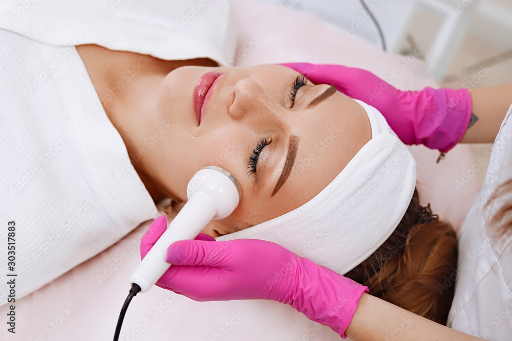 Ultrasound cavitation procedure. Anti-aging, lifting procedure. Stock ...