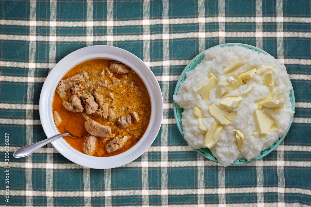 Georgian meal kharcho with in white bowl with gomi made from corn ...
