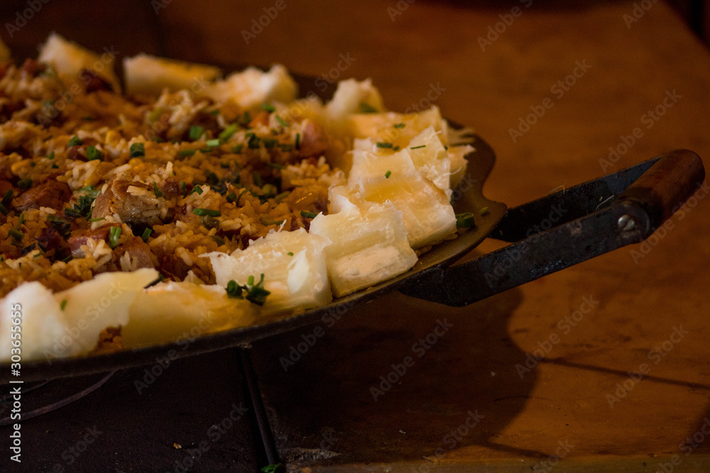 Paella caipira emitting smoke, traditional dish from brazilian ...
