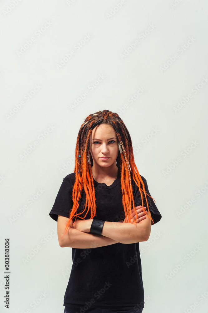 Girl with red fire dreadlocks on a white background. A young woman with ...