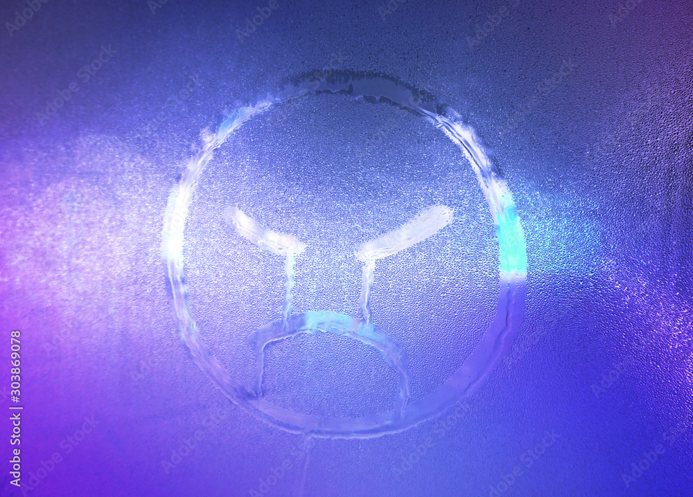 Sad face on a wet window glass Stock Photo | Adobe Stock