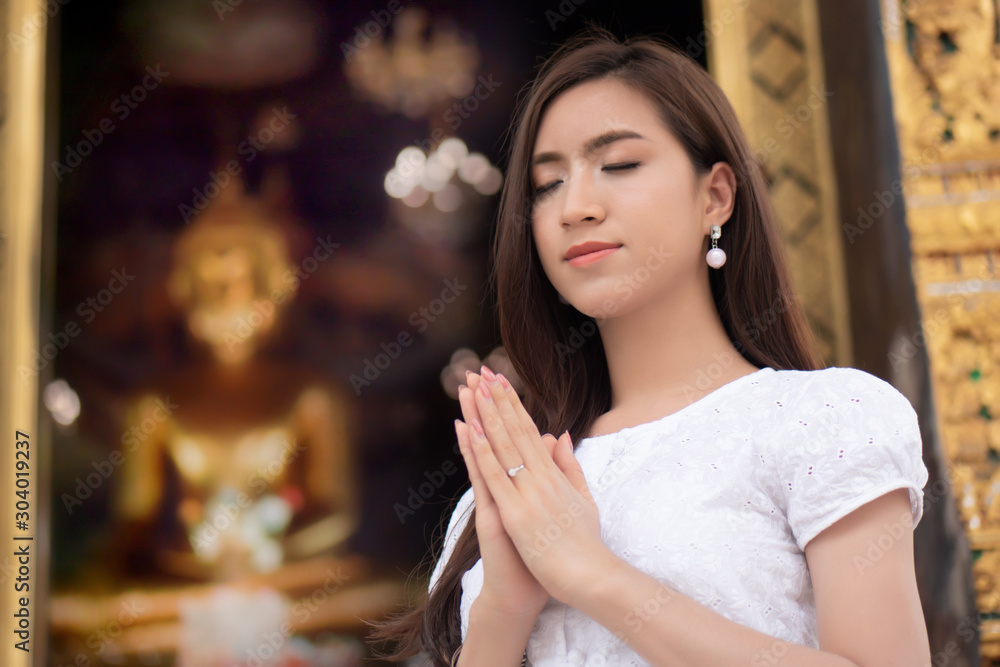 Religious Asian buddhist woman praying. Female buddhist disciple ...