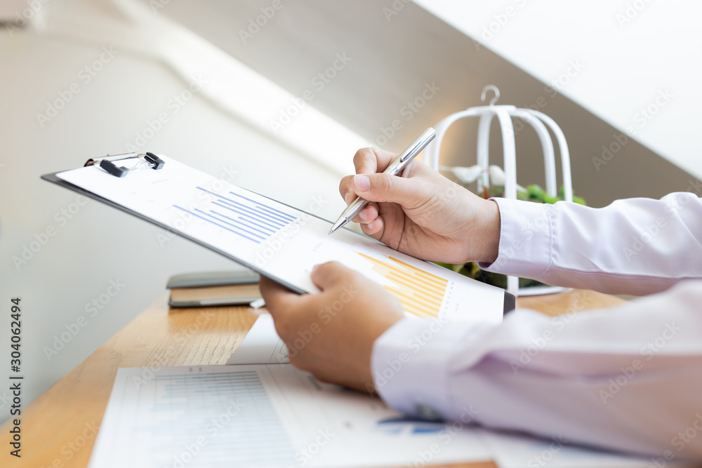 Analyzing graphs, Chai used a pen to point to the graph to analyze the ...