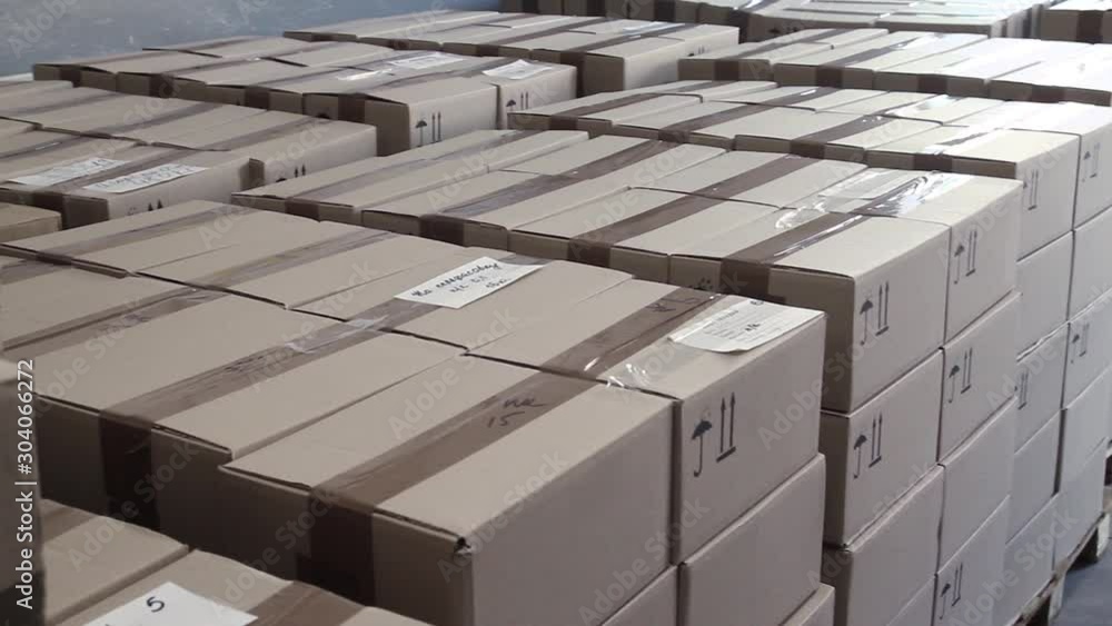 Boxes with products stacked in stock, ready to be sent for sale. Paper ...