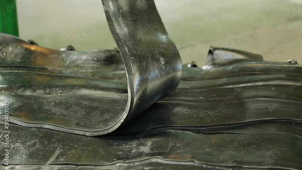 Machine with large shafts kneads rubber compound. Smooth processed ...