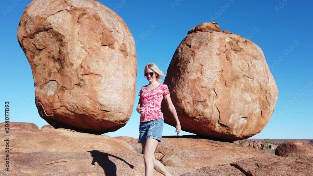 girl walking at Devils Marbles, Northern Territory: Eggs of mythical ...