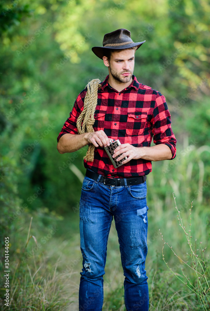 wild wild west. wild west rodeo. man in hat drink whiskey. western ...