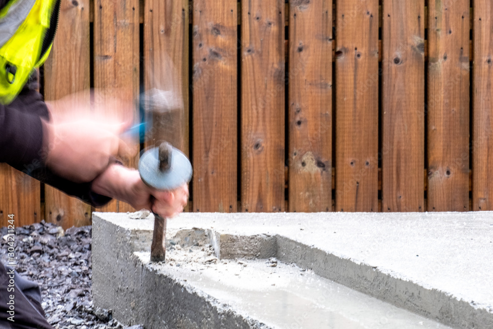 Photo & Art Print Motion blurred chipping away at the concrete base ...