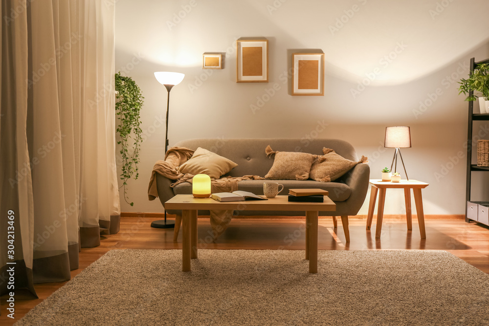 Stylish interior of living room at night Stock Photo | Adobe Stock
