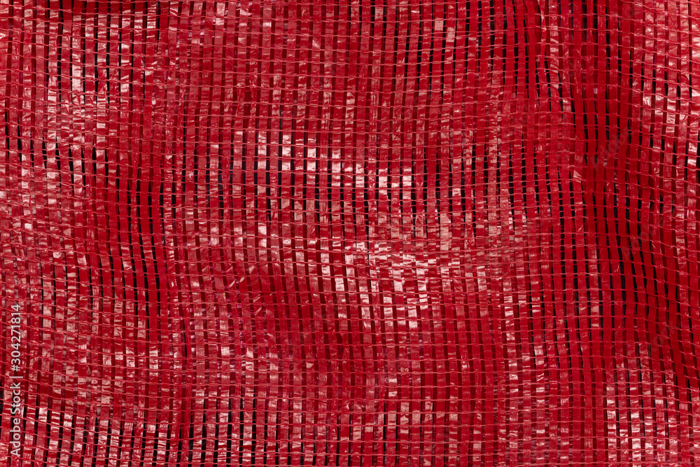 Red woven plastic net for packaging fruits, vegetables, or products ...