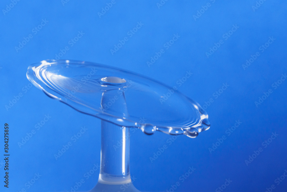 Water drop collision form with blue background Stock Photo | Adobe Stock