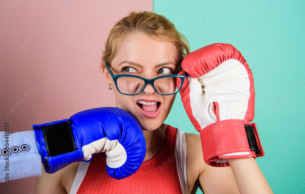 Strong punch. Hand in boxing glove punching female face. Painful punch ...