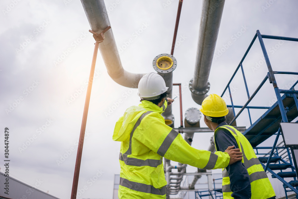 Mechanical engineer working install chilled water pipe system. Engineer ...