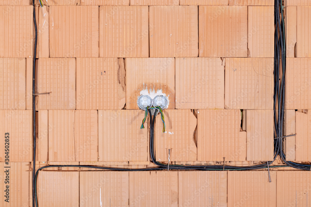 Socket back boxes with wires in a wall. Cabling background. Colorful ...