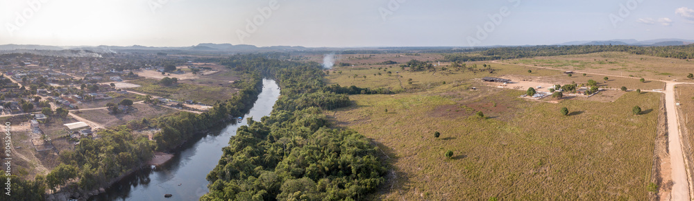Castelo dos Sonhos city with fog, Curua River and cattle farm pasture ...