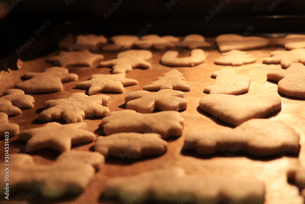 Christmas trees, cars, stars and others in oven. Baking christmas ...
