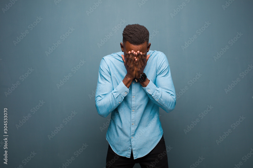 Fotografia do Stock: young african american black man feeling sad ...