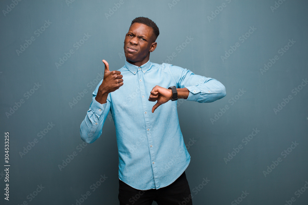young african american black man feeling confused, clueless and unsure ...