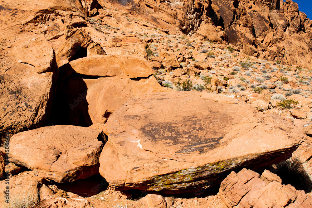 Pre-columbian Native American petroglyphs on a large rock in its ...