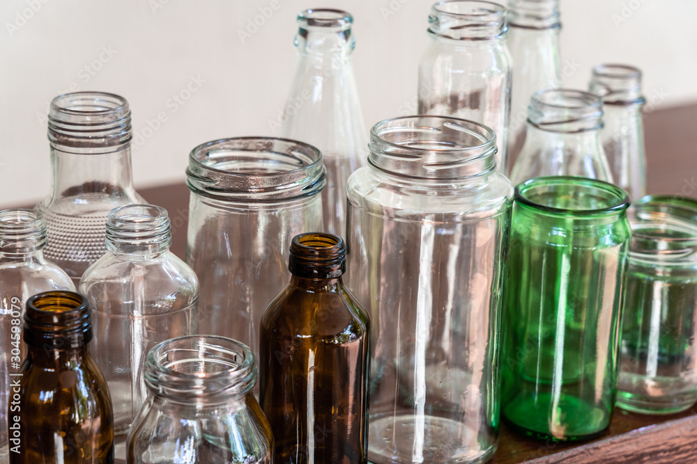 Variety shape and color of empty glass container bottles, reuse things ...