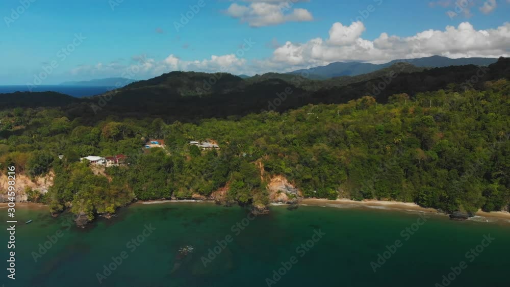 Epic aerial of secluded beaches only accesible by boat with mountains ...