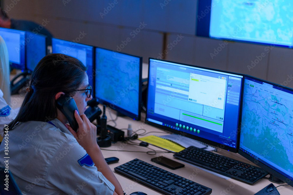 Technical Operator Works at His Workstation with Multiple Displays ...