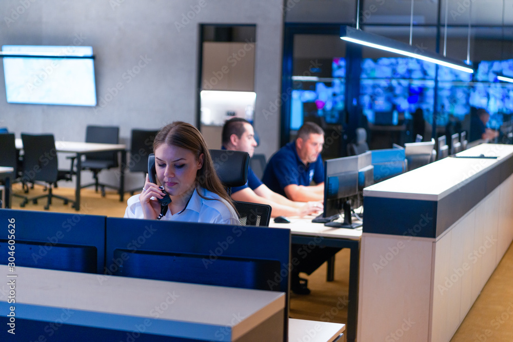 Technical Operator Works at Her Workstation with Multiple Displays ...