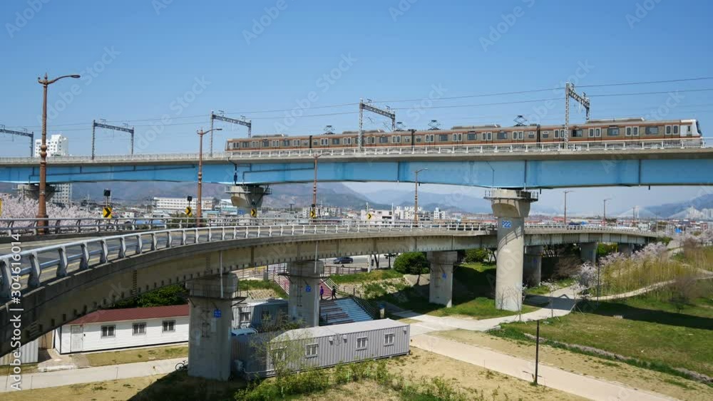 Elevated rail metro system travel across over the elevated highway of ...