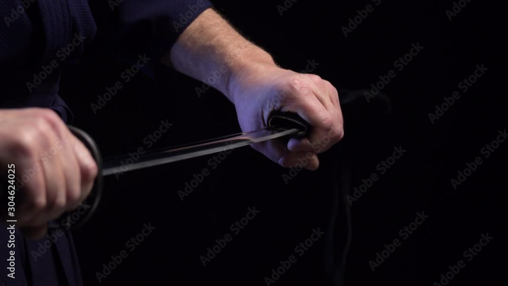 Samurai sword katana in hand. Katana sword holding in Samurai hand ...