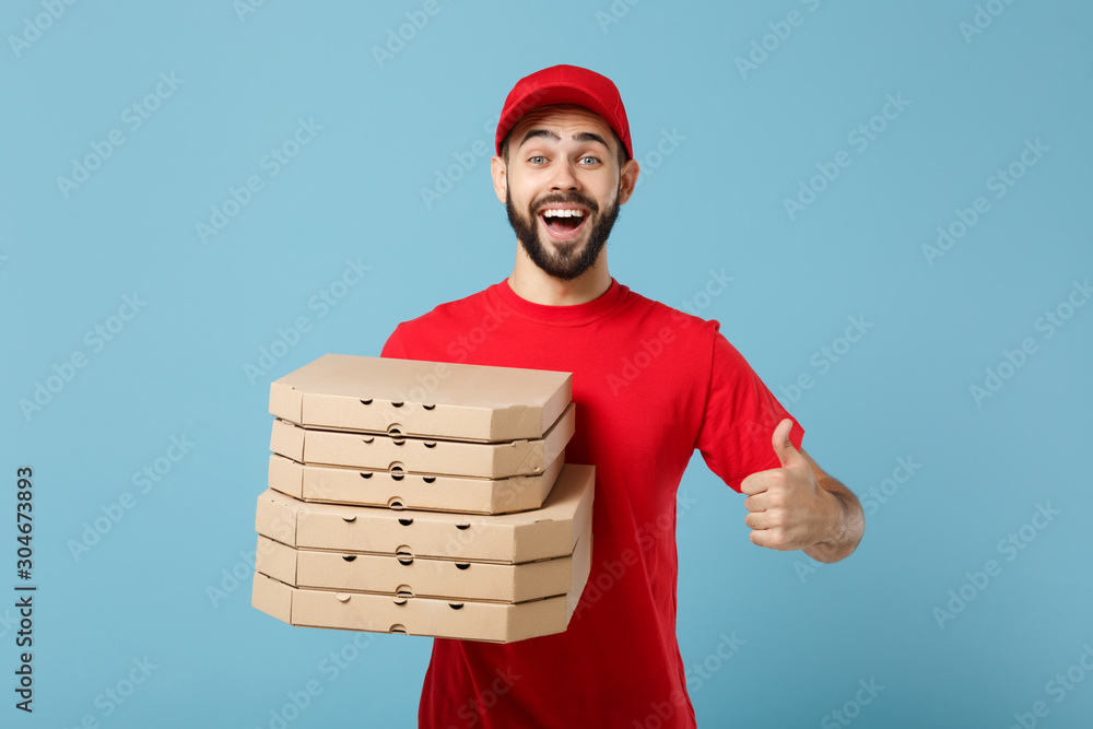 Delivery man in red workwear giving food order pizza boxes isolated on ...