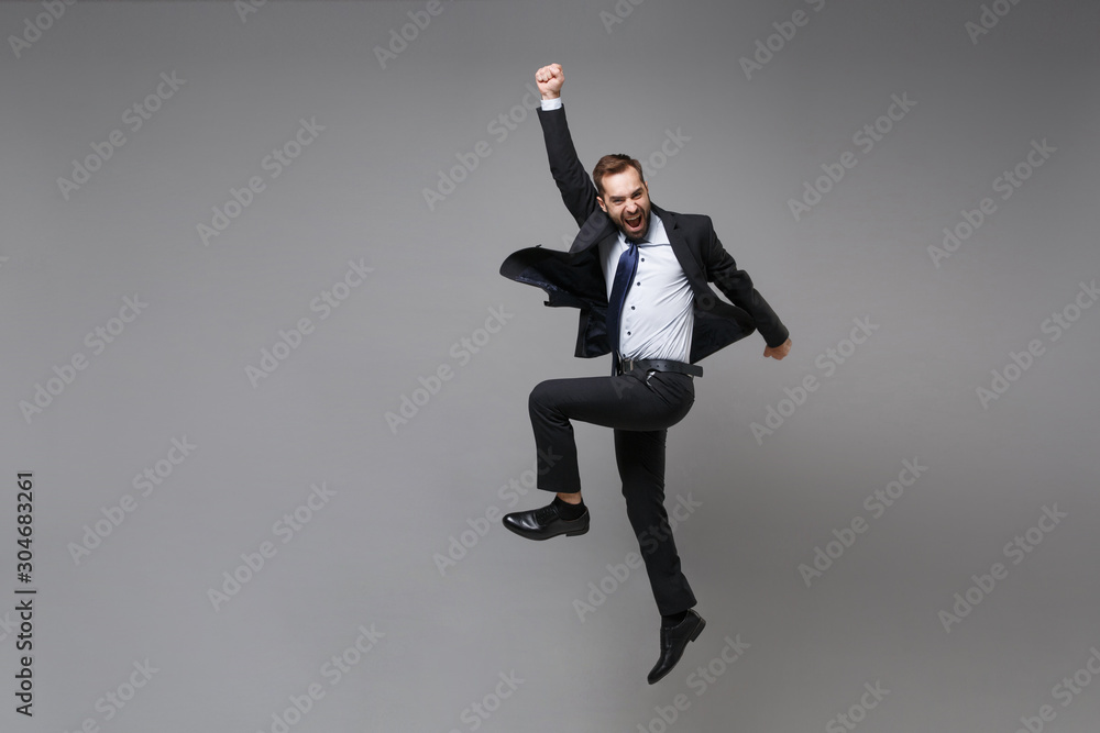 Happy young business man in classic black suit shirt tie posing ...
