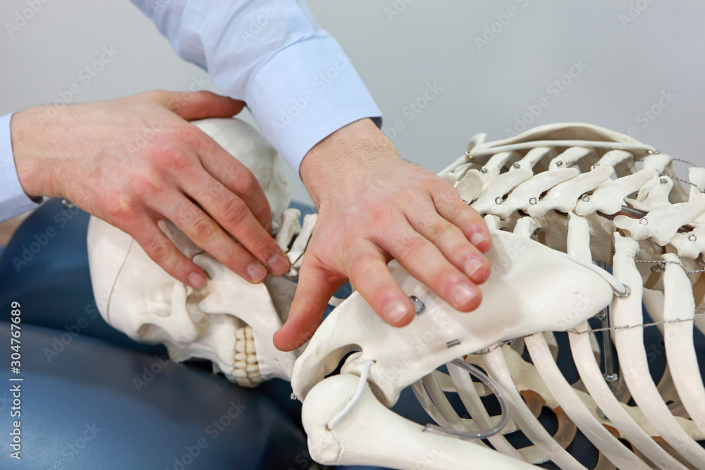 Demonstration of osteopathic techniques on the skull and shoulder Stock ...