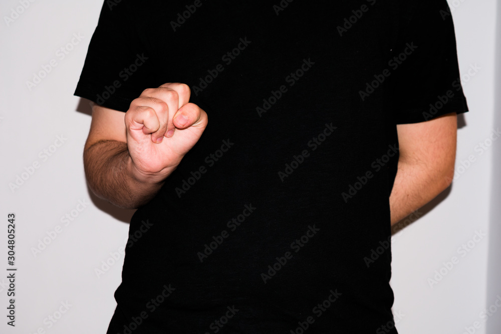 Young sign-language interpreter, showing a "S" in American Sign ...