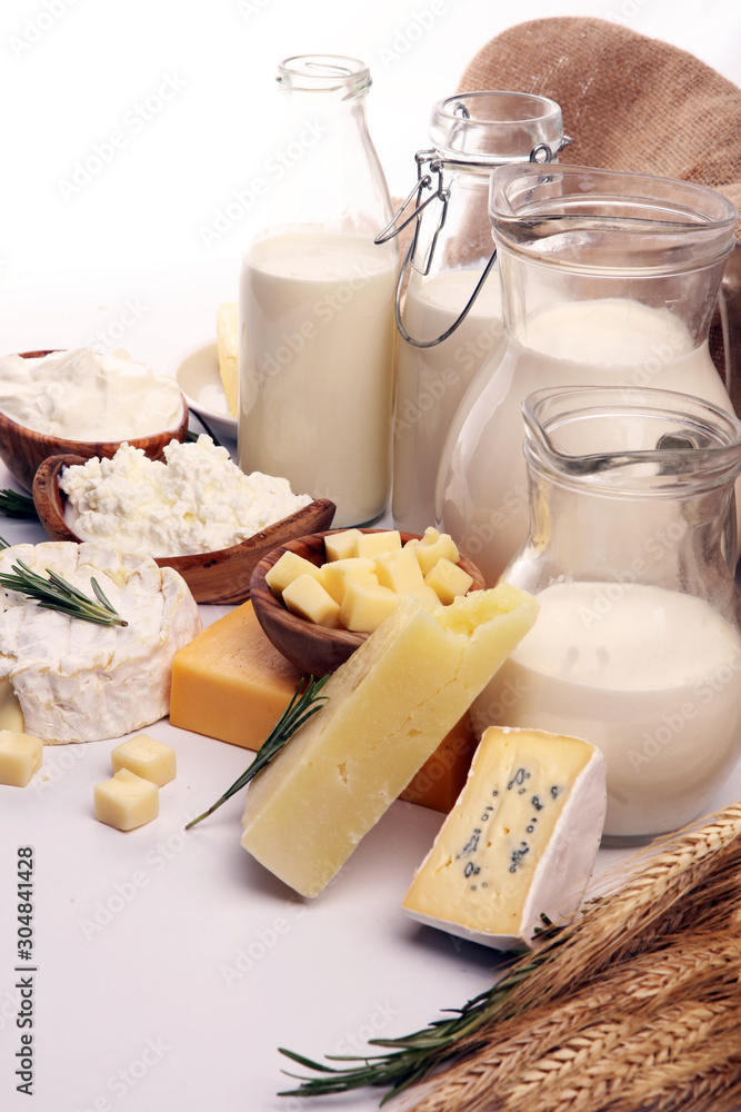 Different healthy dairy products on rustic background with milk, cheese ...
