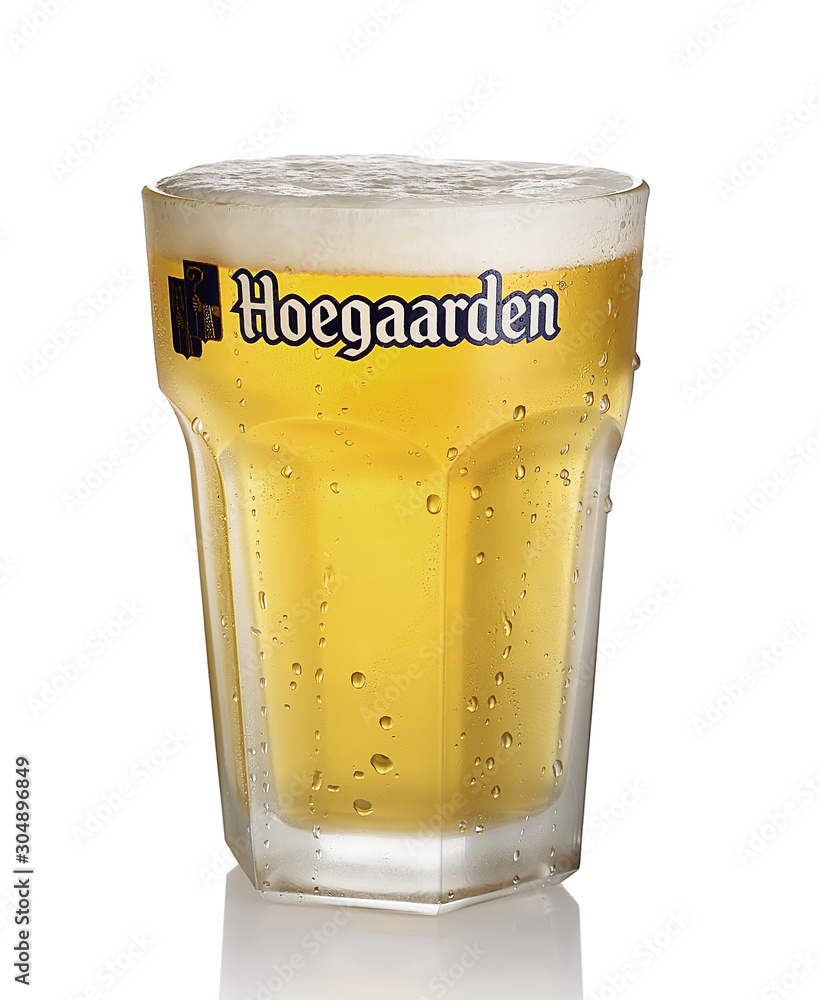POLTAVA, UKRAINE - MARCH 22, 2019: a glass of Hoegaarden beer on a ...