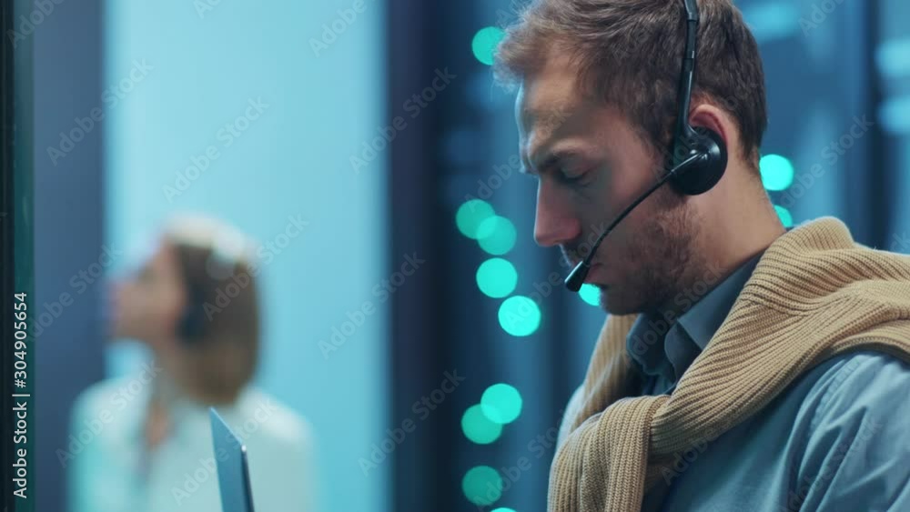 Data center support technician using laptop computer updating hardware ... Data center support technician using laptop computer updating hardware ...