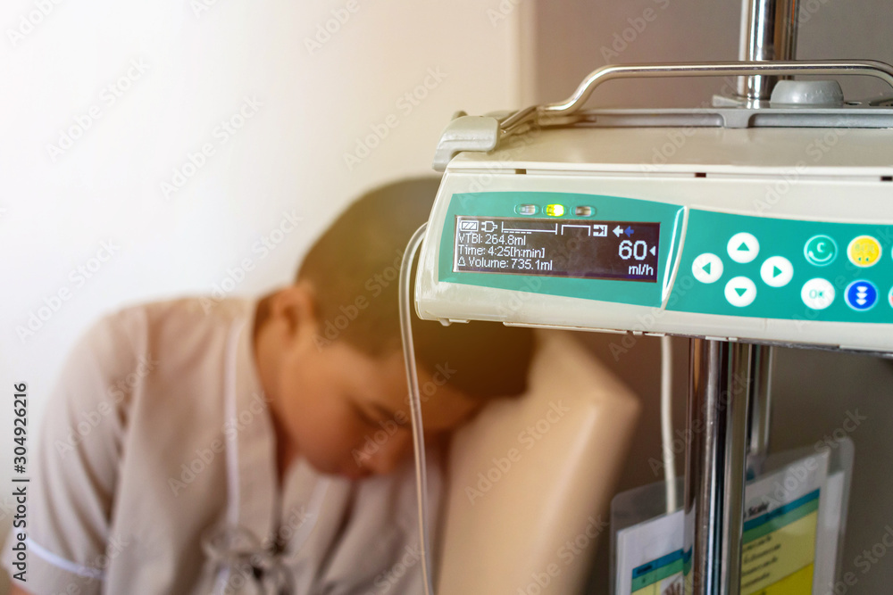 Sick child lying in a hospital with sodium chloride solution for ...