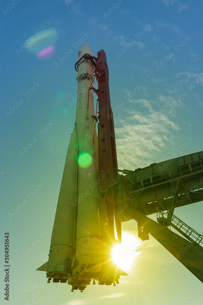 Russian space rocket Vostok at launching platform, lens flare optical ...