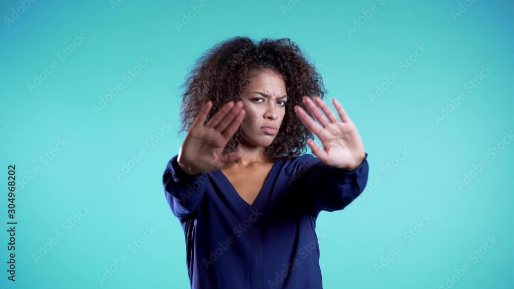 Angry annoyed woman raising hands up to say no stop. Sceptical and ...