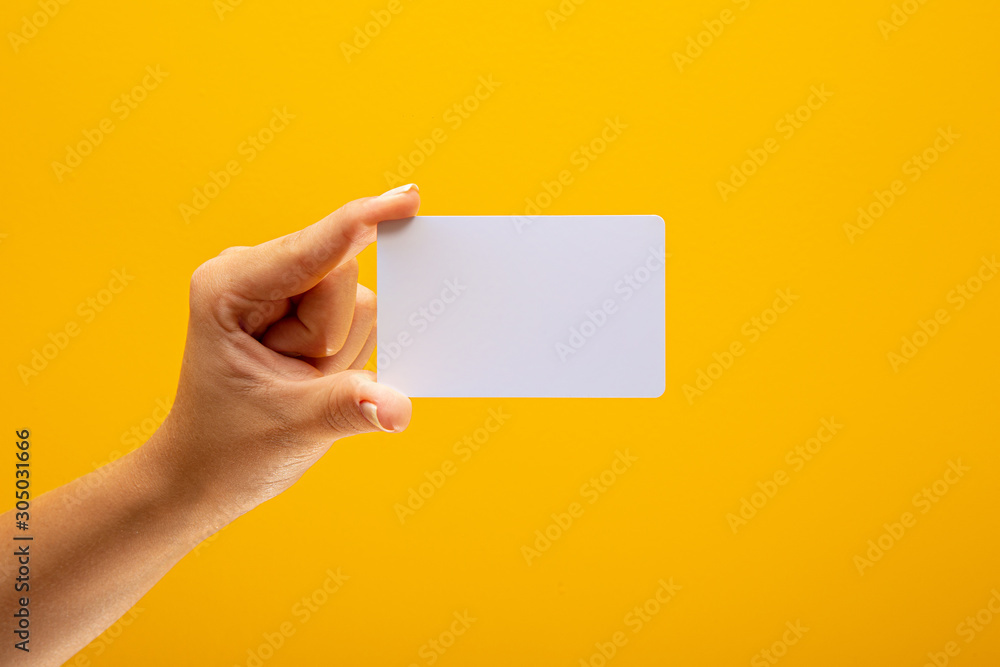 Hand hold blank white card mockup with rounded corners. Plain call-card ...