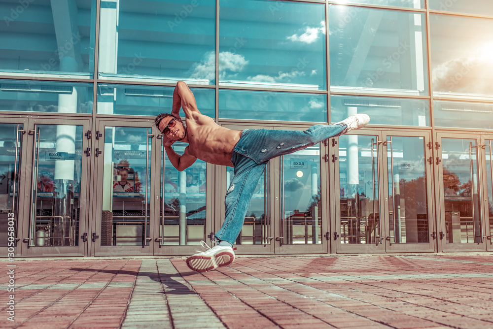 Jumping flight, young active dancer, trained tanned torso, sport man ...