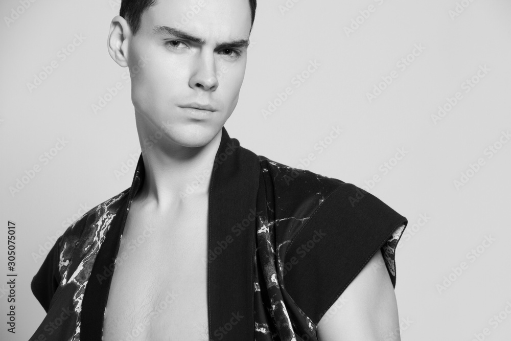 Muscle strong beautiful stripped male model portrait on isolated font ...