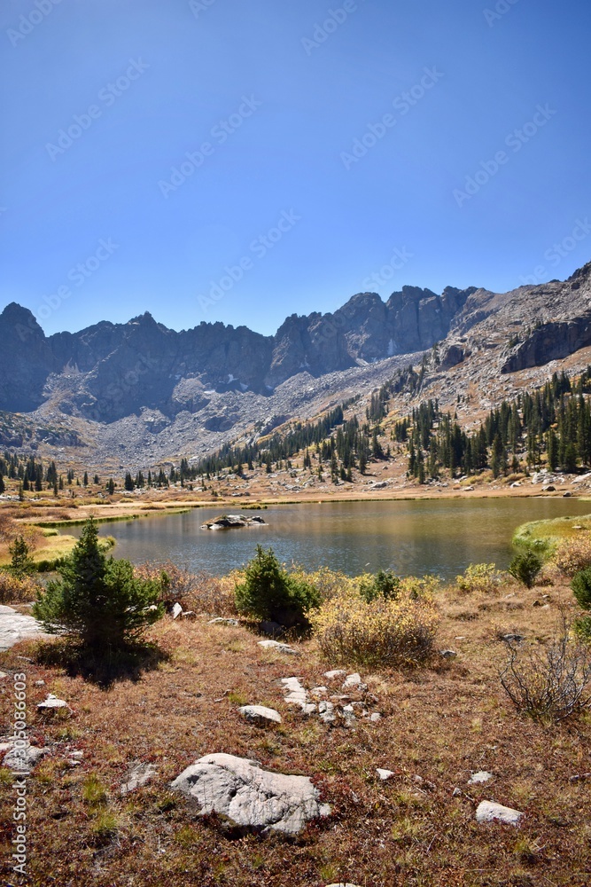 Beautiful alpine meadows and lakes amidst the rugged Gore Range in the ...