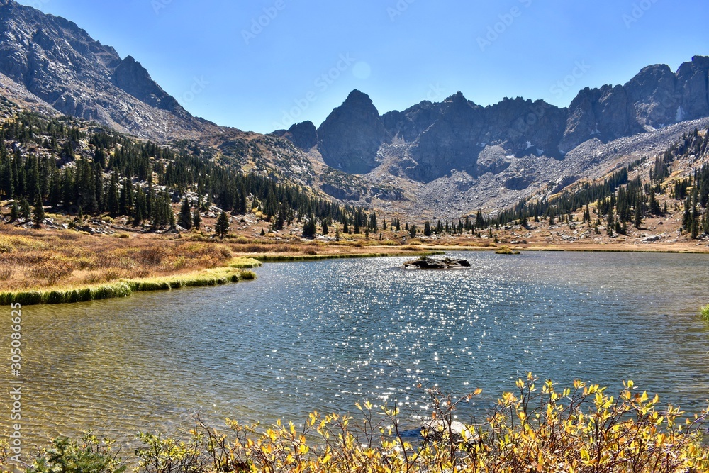 Beautiful alpine meadows and lakes amidst the rugged Gore Range in the ...