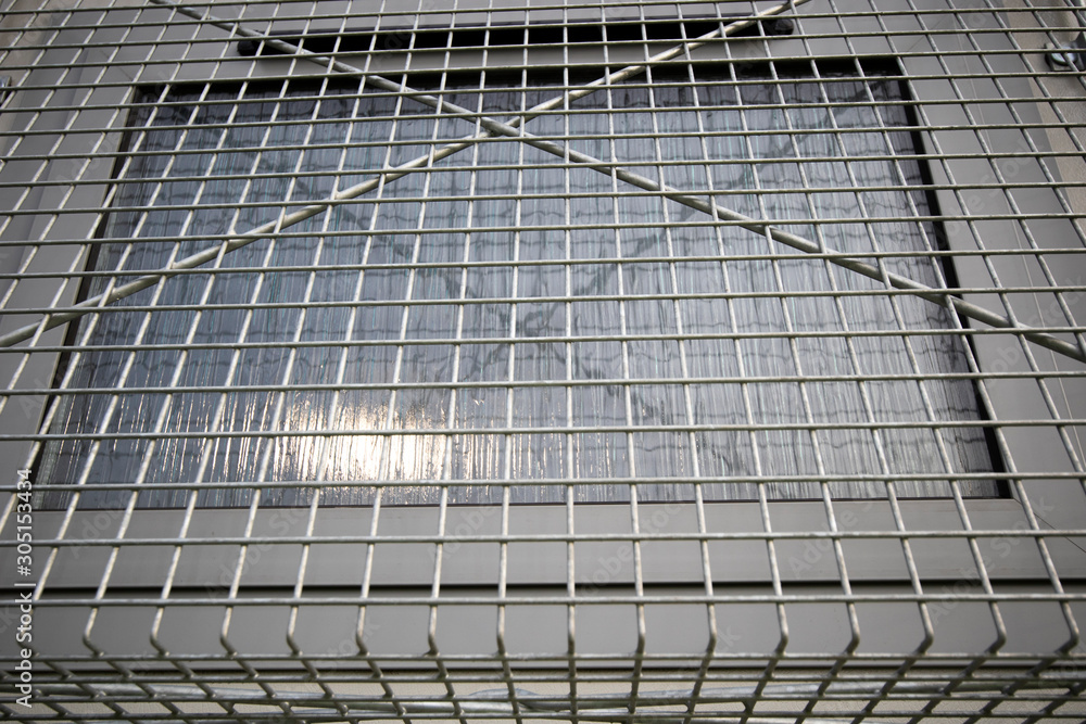 Window security wire mesh frame fixed externally to building wall to ...