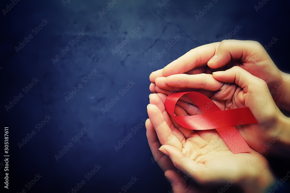 Symbol of human immunodeficiency virus disease. Red ribbon. A helping ...